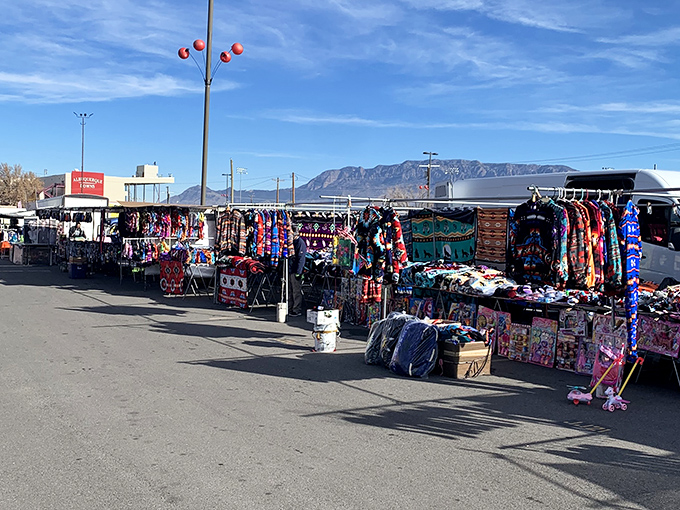 The Sandia Mountains provide a dramatic backdrop for these colorful clothing vendors. Fashion with a view&mdash;take that, Fifth Avenue!