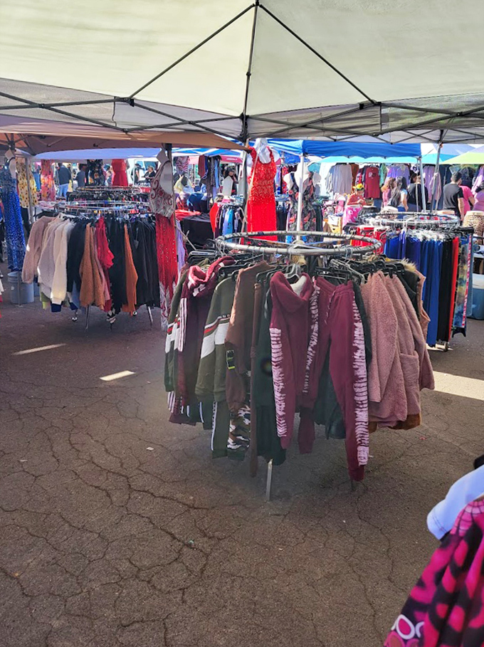 Circular racks spin with possibilities as shoppers hunt for that perfect layer. That red sequined number is calling someone's name.