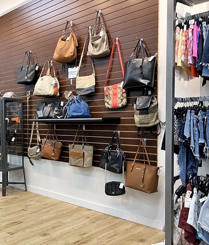 The handbag wall&mdash;a gallery exhibition of practical art pieces that once cost someone's monthly car payment, now priced like reasonable life choices.