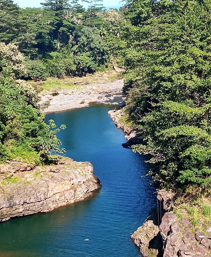 The Wailuku River carves through ancient lava flows. "Destructive water" indeed&mdash;sculpting this masterpiece one persistent drop at a time.
