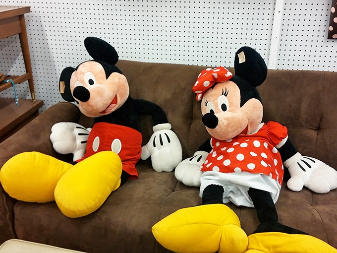 Mickey and Minnie lounging on a sofa like they're waiting for you to join them for a Disney marathon weekend.
