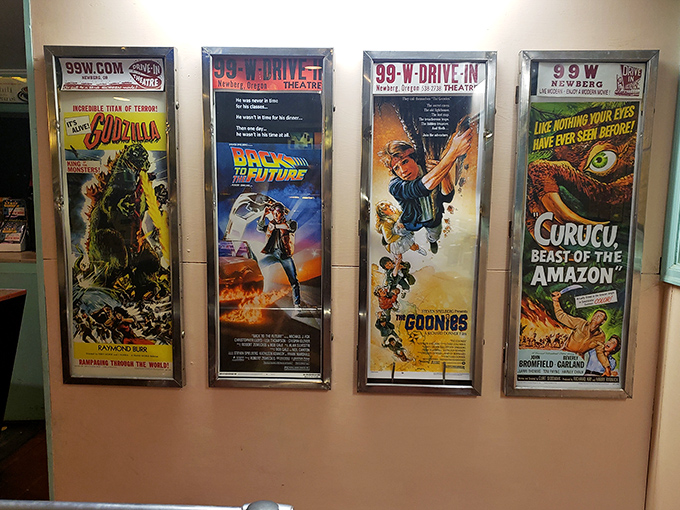 Classic movie posters line the walls like badges of honor, reminding us that "The Goonies" and "Back to the Future" deserve more than a laptop screen.