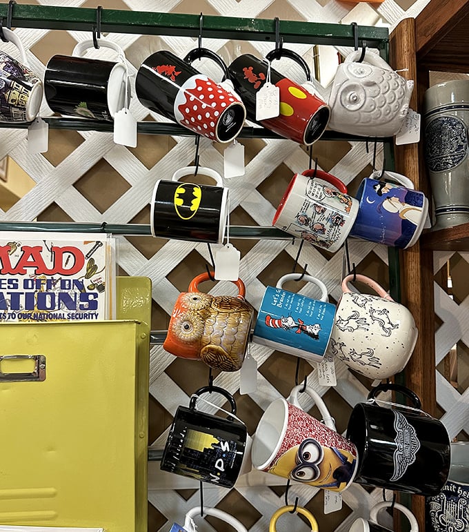 Coffee mugs spanning decades of pop culture, from wholesome cartoon characters to designs that definitely captured their specific era.