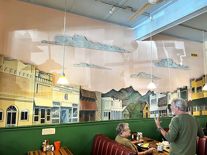The whimsical mural depicting historic Calistoga transports diners to simpler times, creating a backdrop for conversations that flow as easily as the coffee.