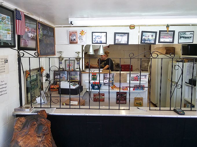 The holy grail of honest food awaits beyond this counter, where photos of satisfied customers serve as testimonials and the American flag stands guard.