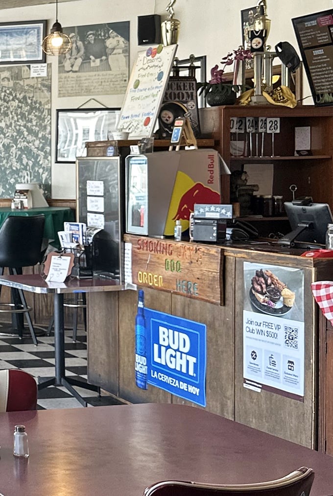 The order counter where barbecue dreams come true. That wooden sign saying "ORDER HERE" might be the most important directional sign in Omaha.
