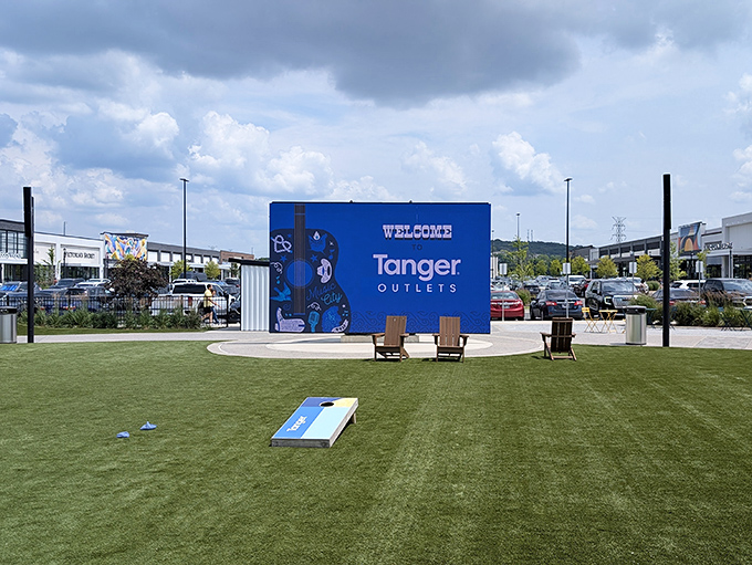 The welcome sign and lawn games create a resort-like atmosphere. Who knew discount shopping could feel like a mini-vacation?