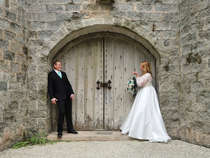 The massive wooden door serves as a portal between modern Florida and a realm where knights and nobility once roamed.