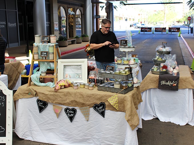 Artisanal charm on display. This vendor's carefully arranged table with rustic burlap bunting shows that presentation is half the farmers market experience.