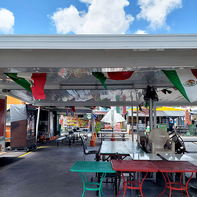 The food court's festive Mexican flags and colorful tables create the perfect pit stop for hungry shoppers needing fuel for the next round of bargain hunting.
