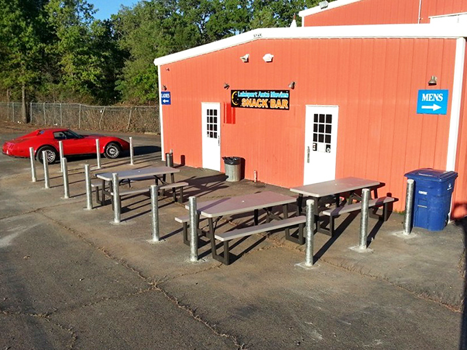Picnic tables outside the snack bar offer the perfect intermission gathering spot, where strangers become neighbors united by movie talk.