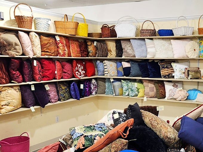 A pillow collector's fever dream. This corner offers enough cushions to build the world's coziest fort or survive a decade of couch naps.