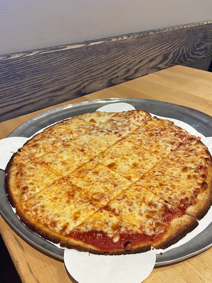 Thin-crust pizza cut into squares&mdash;the way Chicago locals actually eat pizza when tourists aren't looking. Cheese bronzed to perfection like it got the best tan on Lake Michigan.
