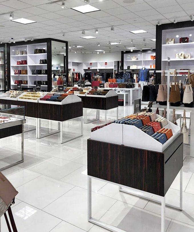 Coach's sleek displays present luxury handbags at prices that won't require explaining to your spouse over dinner tonight.