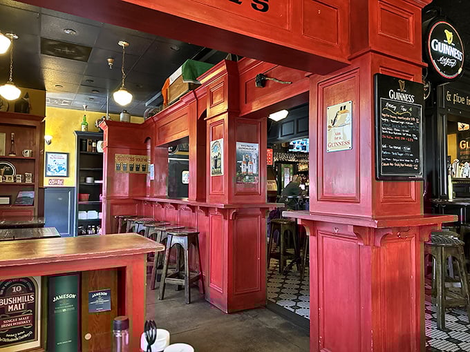 Bright red woodwork and vintage signs create an atmosphere where every seat feels like the best seat in the house.