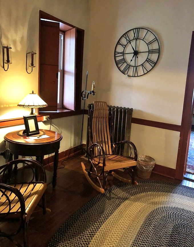 A rocking chair corner that whispers, "Stay awhile." Period-appropriate details make the tavern's lodging as authentic as its menu.