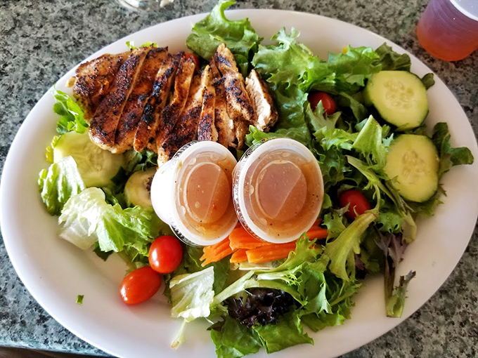 A salad that doesn't apologize for being healthy. That grilled chicken and those fresh vegetables are having the kind of party your doctor would actually approve of.