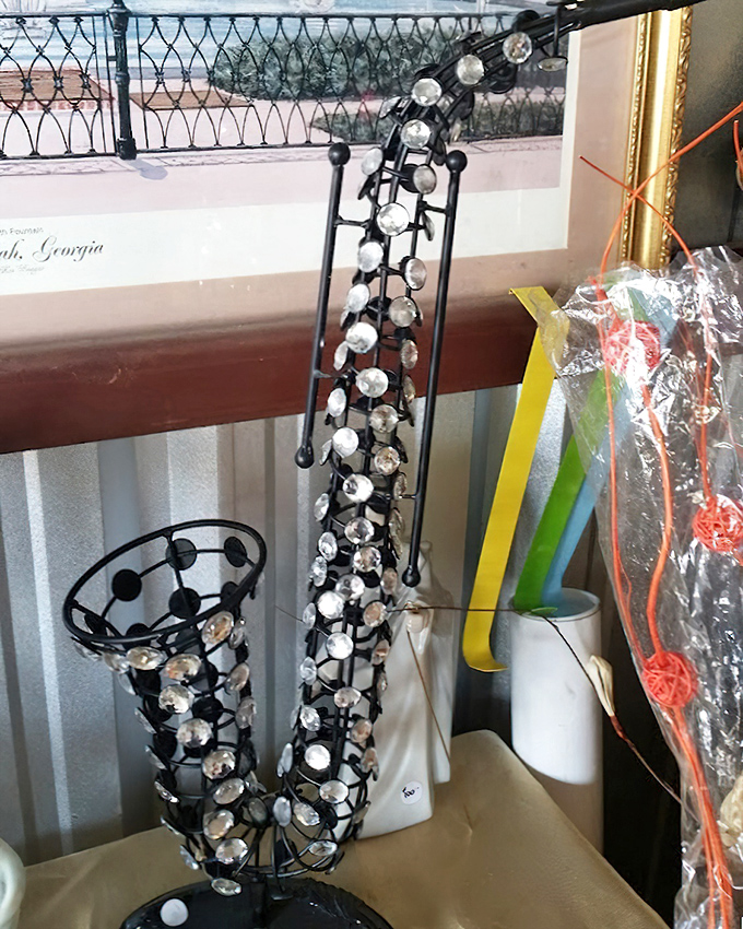 This decorative saxophone sculpture adds jazzy elegance to any room craving a musical conversation starter piece.