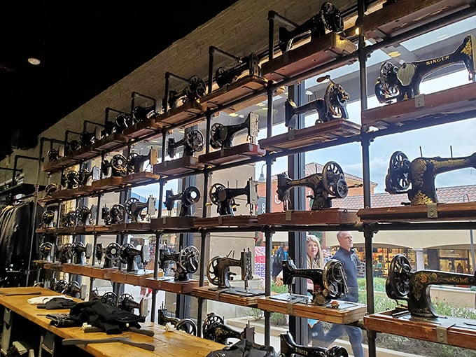 A wall of vintage sewing machines creates an unexpected art installation. Yesterday's technology becomes today's Instagram backdrop for tomorrow's purchases.