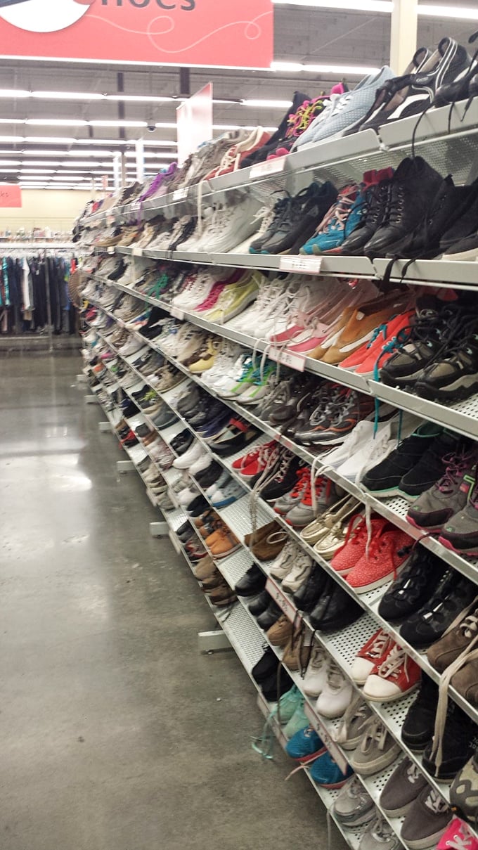 The shoe section: a footwear buffet where hiking boots and dress shoes coexist in harmony rarely seen in regular closets.