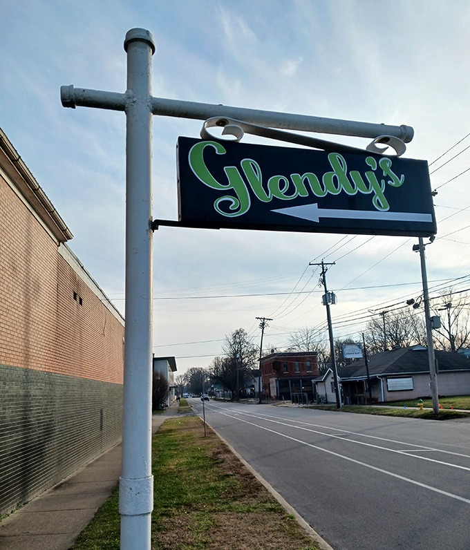 The roadside sign beckons like an old friend. That classic script practically whispers, "Yes, this is the place you've been looking for."