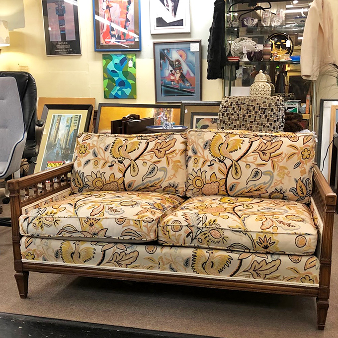 That mid-century loveseat with its botanical upholstery is practically screaming, "Draw me like one of your French sofas!"