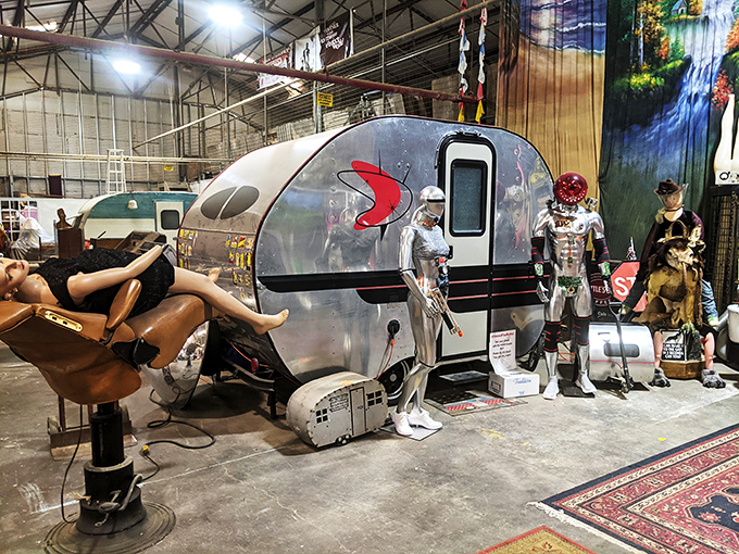 The oddities corner featuring a vintage camper and metallic friends. Like a David Lynch film set where everything is surprisingly for sale.