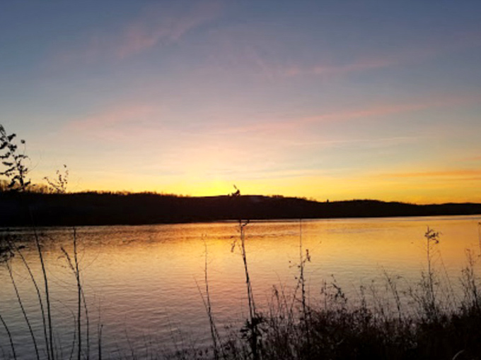 Mother Nature's goodnight show paints the river in impossible colors. No filter needed&mdash;though your friends on Instagram won't believe you.