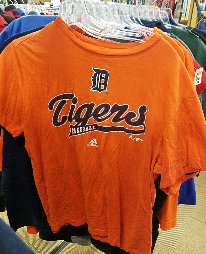Detroit Tigers gear hangs proudly, because in Michigan, team loyalty apparently extends to thrift store shopping.