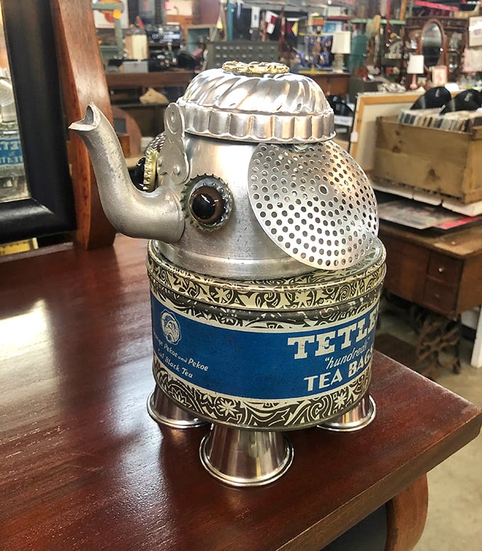 That ornate tea kettle looks ready to whistle its way into someone's collection – practical elegance from another era.