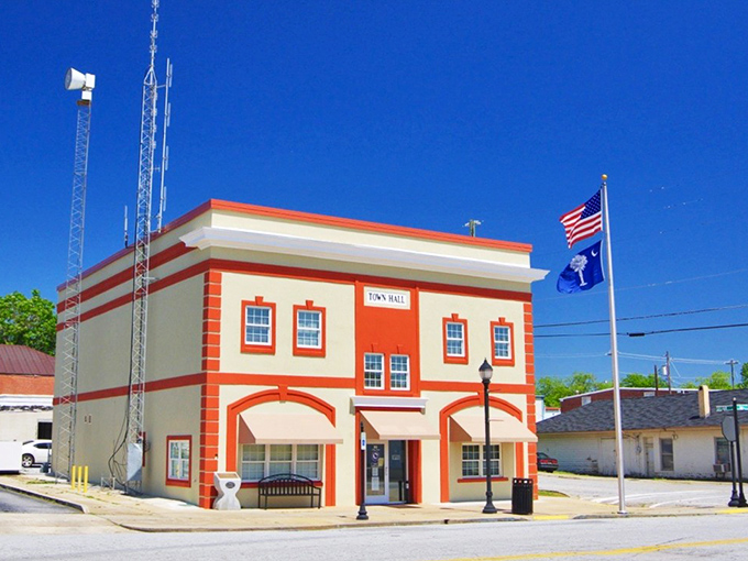 Town Hall stands proudly in its patriotic colors, the heart of local government where decisions affecting daily life are made face-to-face.