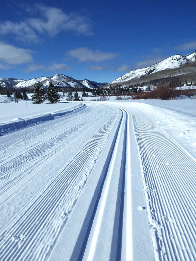 Winter transforms Steamboat Lake into a wonderland of perfectly groomed trails that practically beg you to strap on some cross-country skis.