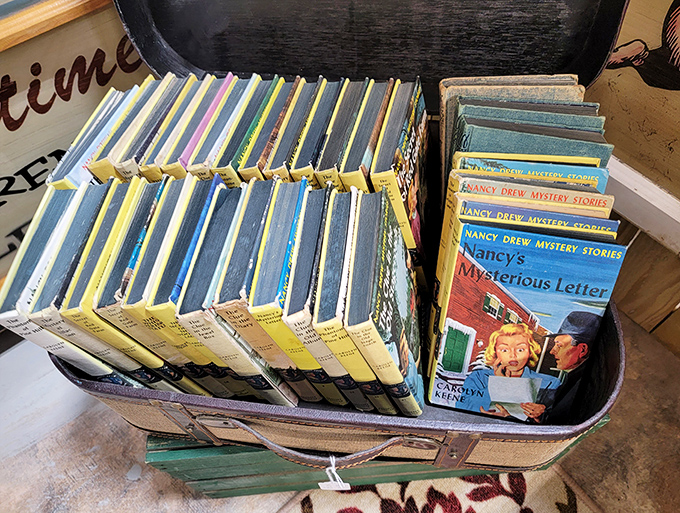 Nancy Drew mysteries stacked like time capsules of adolescent adventure. These yellowed pages once kept kids up past bedtime, flashlights under covers, hearts racing.