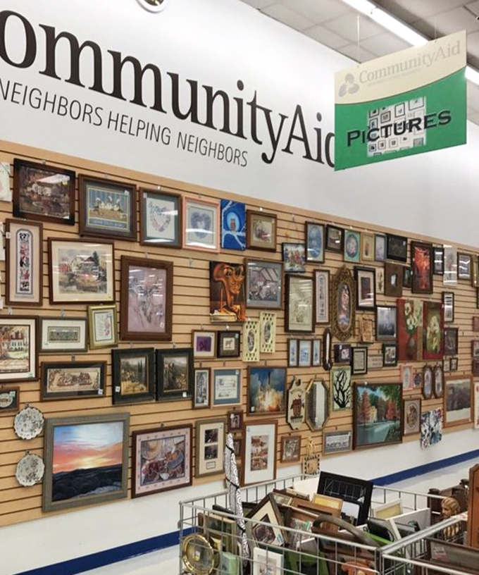 The wall of frames showcases art for every taste. From serene landscapes to quirky abstracts, someone's discarded decor becomes another's treasure.