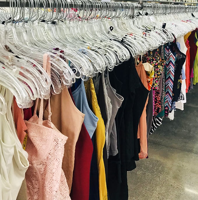 A rainbow of fabrics awaits new owners. Each hanger holds not just clothing but possibilities &ndash; and occasionally, original tags!
