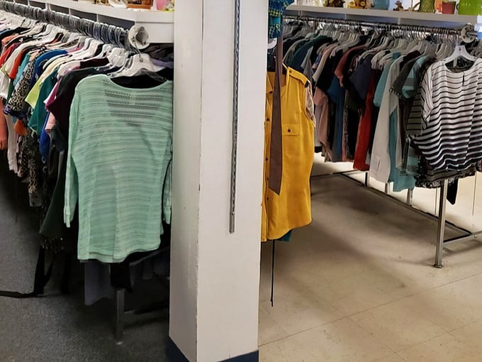 The women's clothing section: where vintage Wranglers hang alongside forgotten designer labels, all waiting for their second act.