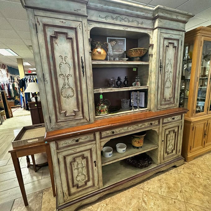 This distressed hutch isn't just furniture; it's architectural salvage with drawers. Imagine the dinner parties it's witnessed and the ones it will host.
