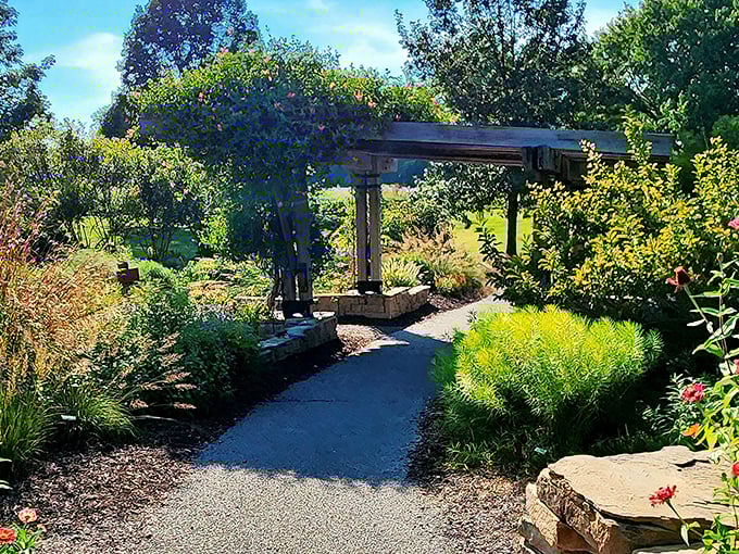 Garden pathways framed by wooden pergolas&mdash;where Midwestern practicality meets the romance of secret garden passages.