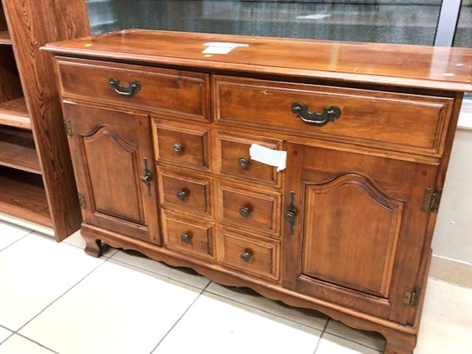 This wooden sideboard has weathered decades with grace. Imagine the dinner parties it's witnessed and the ones it could host in your home.