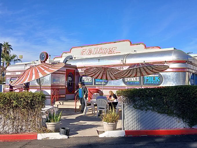 5 & Diner's silver exterior gleams in the sun like a breakfast beacon, calling all hungry travelers to its retro embrace.