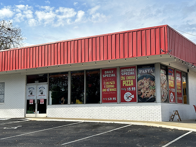 That retro red-and-white building design screams "serious pizza inside" louder than any fancy marketing campaign.