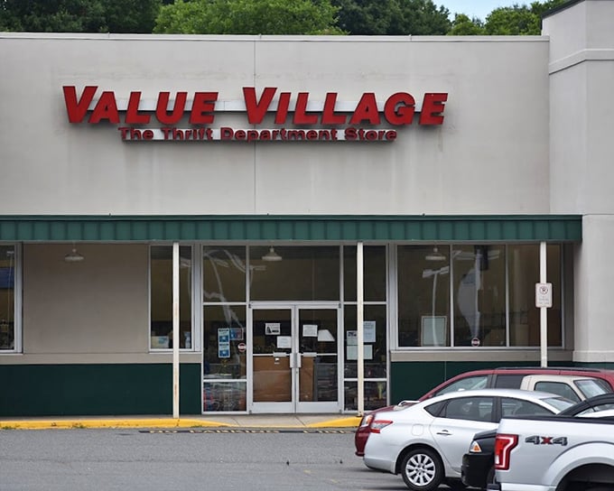 Value Village announces itself boldly, the thrift department store's bright red sign beckoning to bargain hunters like a retail lighthouse.
