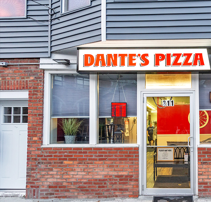Dante's Pizza: That bold orange "DANTE'S PIZZA" sign - like a beacon of hope for the hungry souls of Troy.