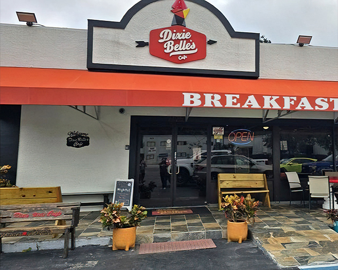 Dixie Belle's Cafe: The cheerful orange awning and rustic bench create the perfect Southern welcome before you even taste the biscuits.