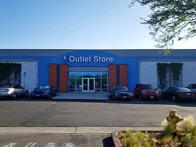 Goodwill's blue fortress houses the legendary "bins" where thrift warriors battle for bargains by the pound.