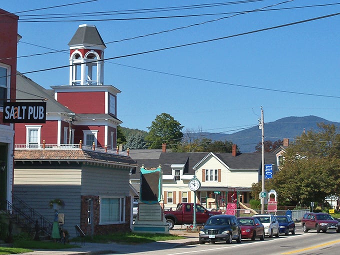 Gorham's Salt Pub stands sentinel with its distinctive red tower, mountains rising majestically in the background. Small-town charm with a side of grandeur!