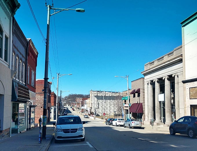 Jeannette's wide main street showcases a mix of historic buildings under bright blue skies, offering retirees affordable small-town charm.