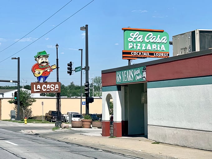 La Casa's vintage signage featuring their guitar-playing mascot is as much an Omaha landmark as the pizza inside is legendary.