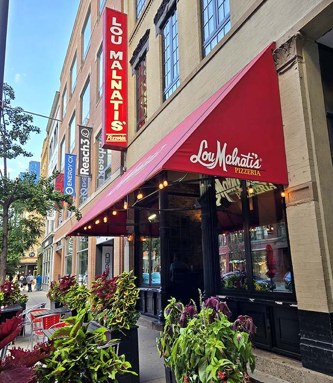 Lou Malnati's red awning and warm lighting create the perfect invitation to deep dish nirvana.