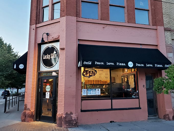 Lucky Slice's pink building stands out like a delicious beacon in downtown Ogden. "Peace. Love. Pizza." &ndash; the holy trinity.